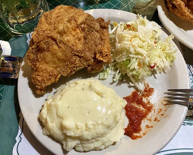 A plate that understands the food pyramid &ndash; crispy chicken, cloud-like mashed potatoes, and just enough coleslaw to count as your vegetable.