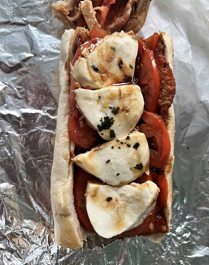 Fresh mozzarella and tomato &ndash; a romance for the ages. This chicken cutlet sandwich proves that sometimes the simplest combinations create the most passionate food affairs.