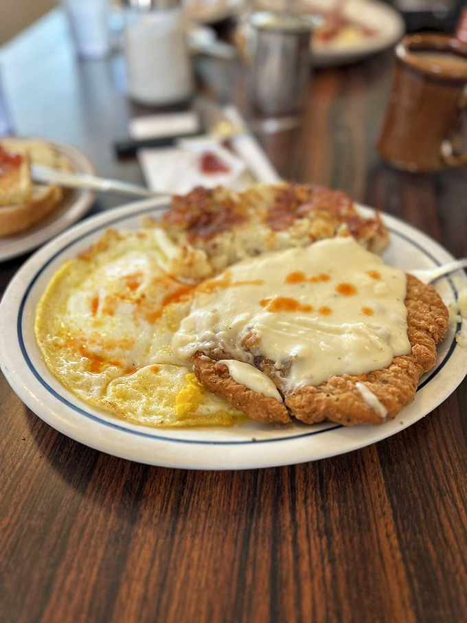 Chicken fried steak so generous it practically requires its own zip code and gravitational pull.