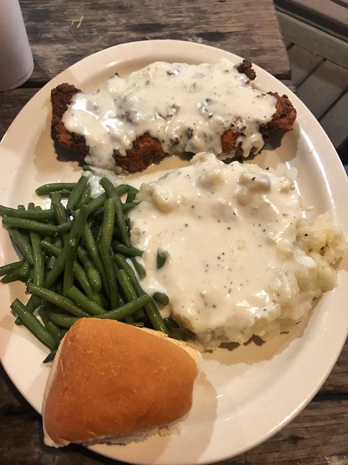 Chicken fried steak smothered in pepper gravy&mdash;the dish that's comforted Texans since cattle first roamed the plains. Pure comfort on a plate.