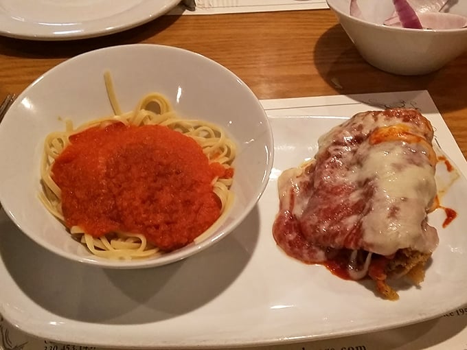 The star of the show: chicken parmesan served alongside spaghetti&mdash;a classic pairing executed with the confidence that comes from decades of perfecting a recipe.