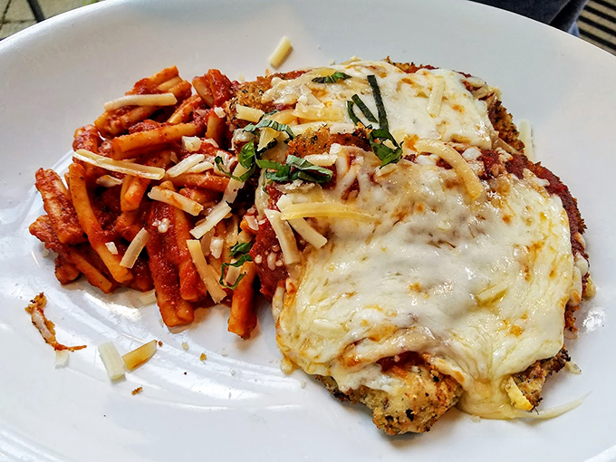 Not your mama's chicken parm (unless your mama is a five-star chef). This beauty comes with pasta that's dressed better than most wedding guests.