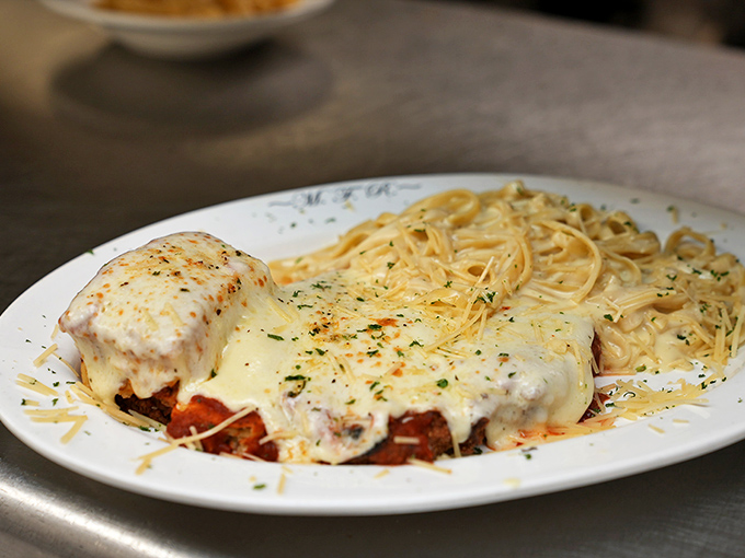 Chicken Parmesan that could make a vegetarian question their life choices. That melted cheese blanket is performing serious comfort food magic.