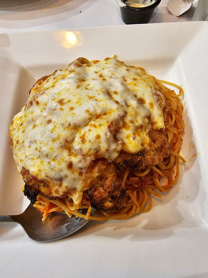 The chicken parm that launched a thousand food dreams. Crispy, cheesy, saucy perfection atop a mountain of spaghetti.