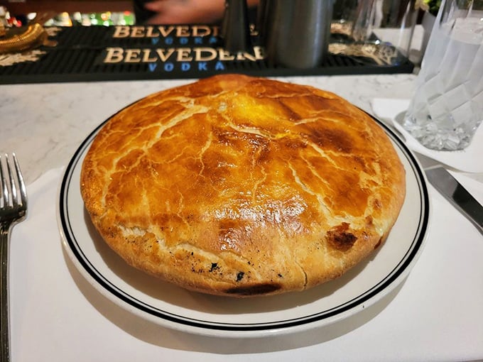 The chicken pot pie arrives like a golden-domed cathedral of comfort. Crack that flaky crust and watch steam escape like delicious memories from childhood.