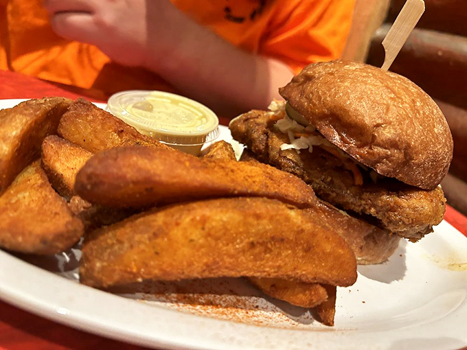 The perfect pairing: a chicken sandwich with crispy potato wedges. This plate has "nap inducement device" written all over it.