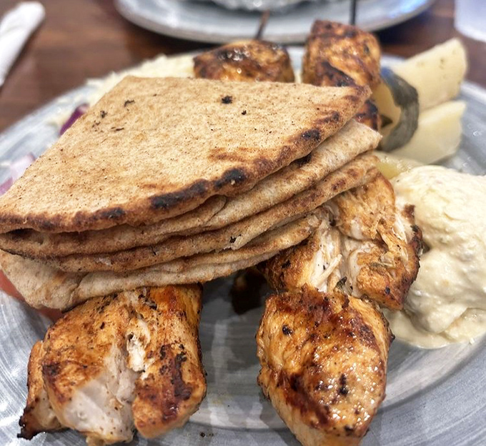 Perfectly charred chicken souvlaki with warm pita&mdash;proof that the simple things in life are often the most delicious.