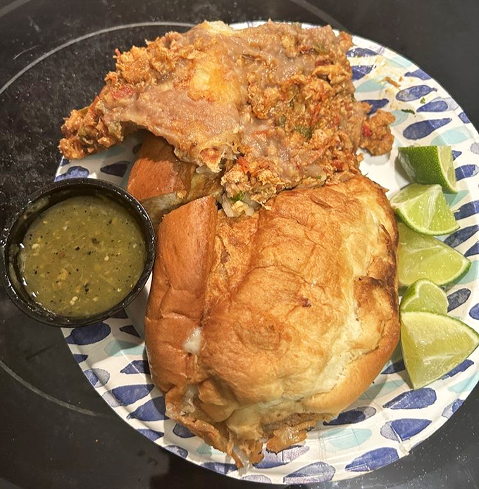 This torta isn't just a sandwich&mdash;it's a masterclass in texture with crispy bread cradling savory meat and fresh vegetables.