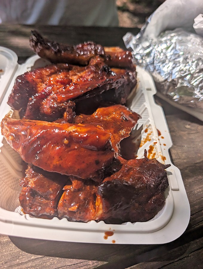 These ribs have that perfect "not-falling-off-the-bone" integrity BBQ purists demand, with a lacquered exterior that glistens like the Holy Grail of meat.