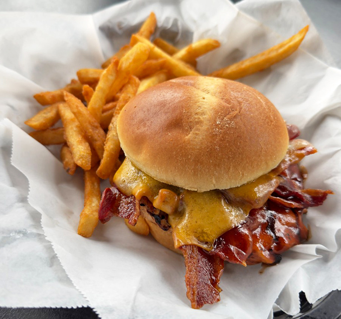 A burger that's guilty of first-degree deliciousness, with crispy fries as willing accomplices to your appetite.