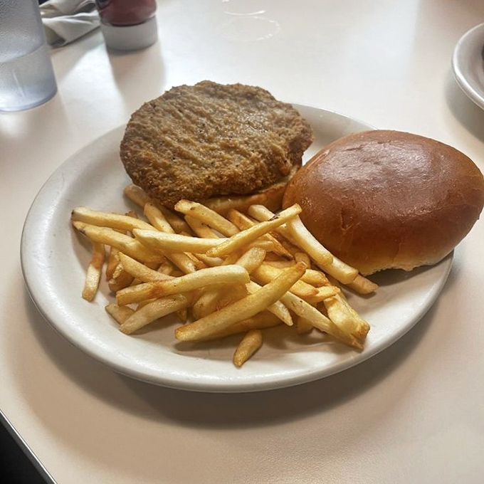 A sandwich that doesn't need a fancy name or artisanal bread&mdash;just honest ingredients stacked between bread with fries that never went to finishing school.