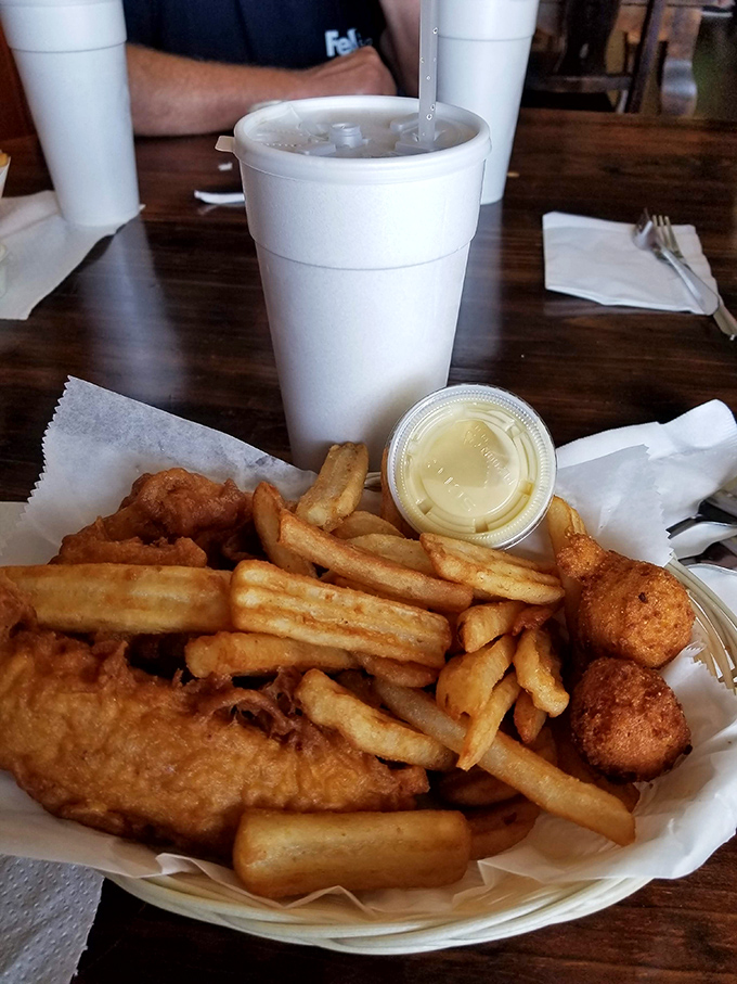 A basket of crispy chicken tenders, golden fries, and hushpuppies&mdash;comfort food's greatest hits album served on humble paper.