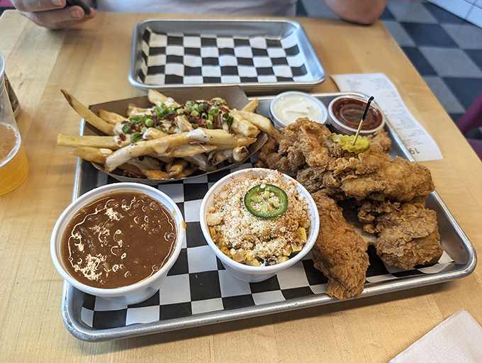 A tray that answers the eternal question: "Can I have it all?" Crispy tenders, loaded corn, beans, and fries say yes, you absolutely can.