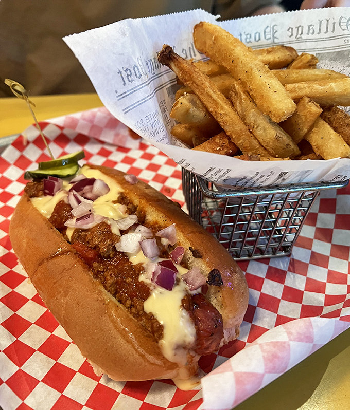 The classic American duo reimagined! This chili dog nestled beside a basket of golden fries is comfort food that speaks to your soul.