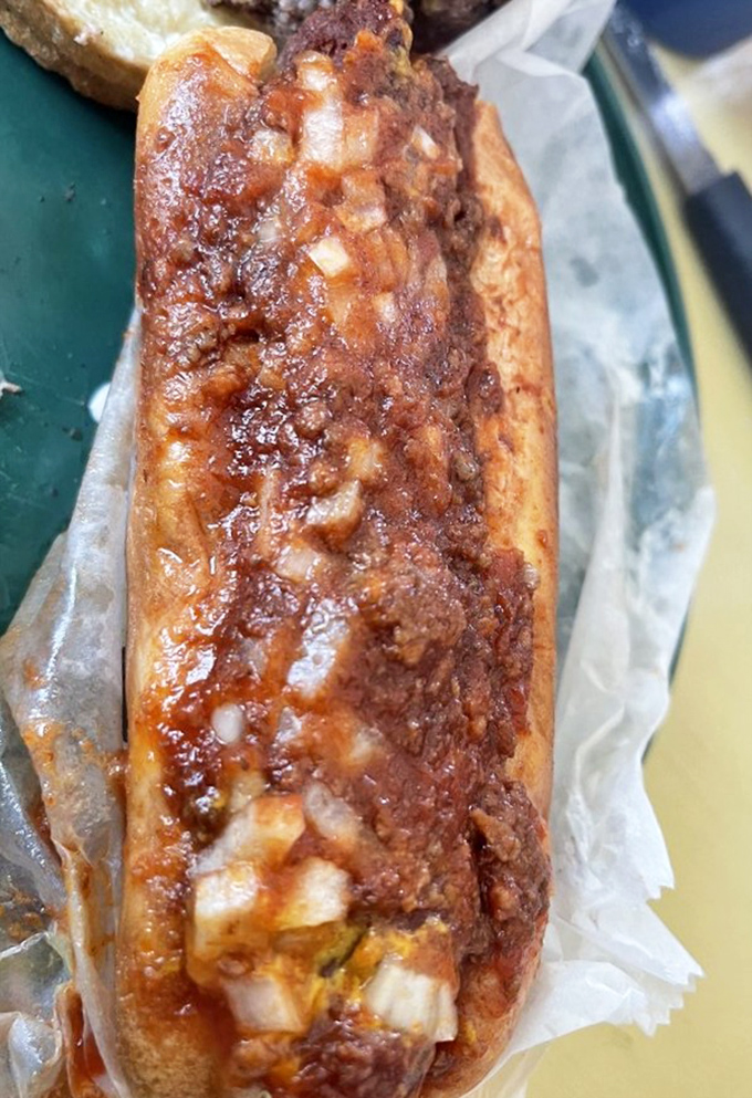 Not just any chili dog &ndash; this is a South Carolina masterpiece. The visible chunks of onion and that glistening sauce tell you everything you need to know.