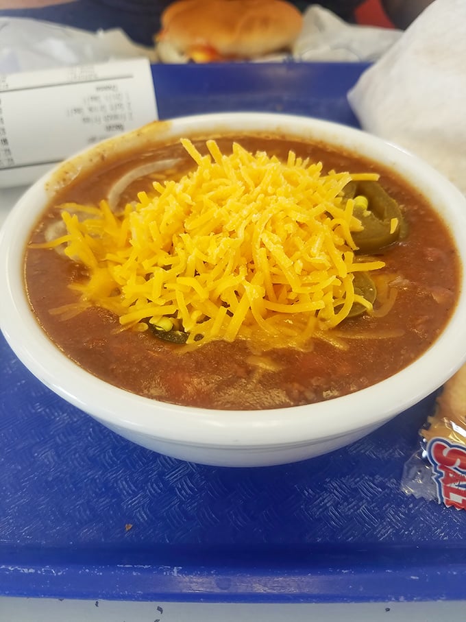 Wilson's famous chili, topped with a mountain of shredded cheddar. This isn't some bean-heavy concoction &ndash; it's meat-forward, Ohio-style comfort that inspires fierce loyalty.