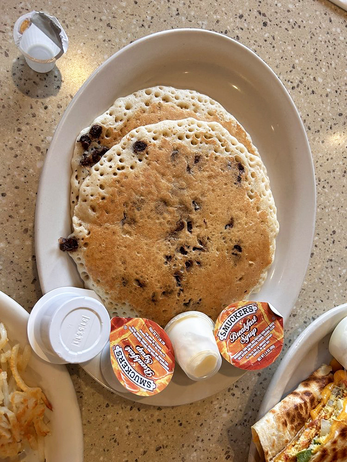 Chocolate chip pancakes so perfectly golden they deserve their own Instagram account. Smuckers on the side&mdash;because some traditions are sacred.