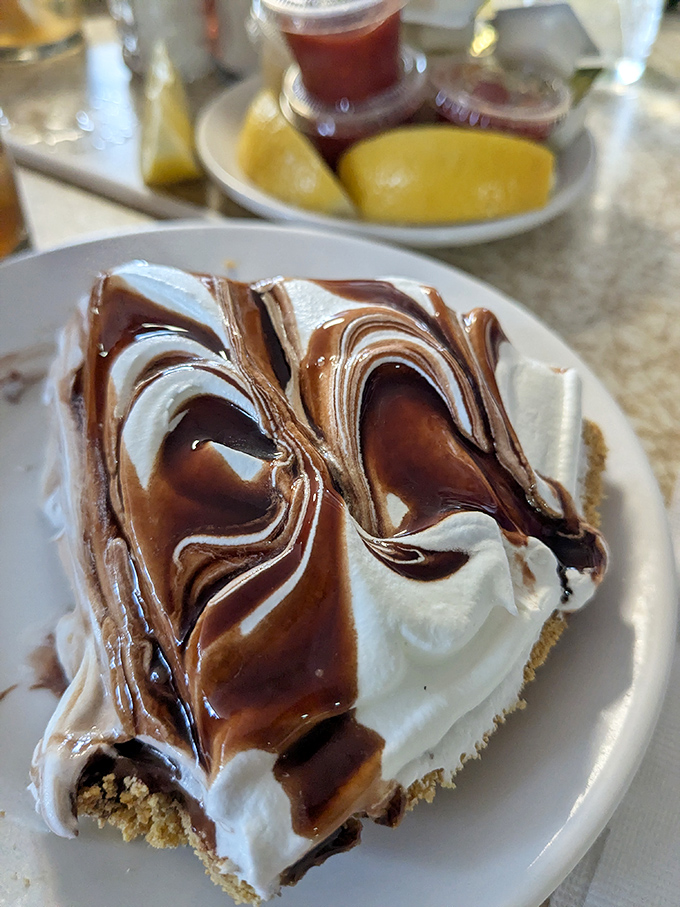 After conquering mountains of fried goodness, the chocolate cream pie offers a sweet finale that would make your grandmother both proud and jealous.