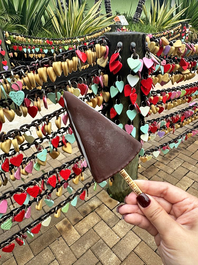 Chocolate-dipped pie on a stick transforms classic dessert into portable paradise for wandering food lovers everywhere.