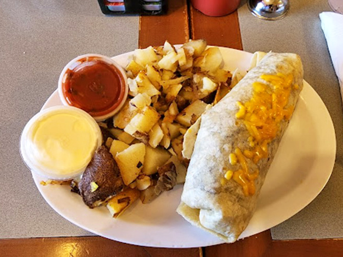 This burrito doesn't just satisfy hunger&mdash;it conquers it! Stuffed with goodness and flanked by home fries, it's a southwestern morning masterpiece.