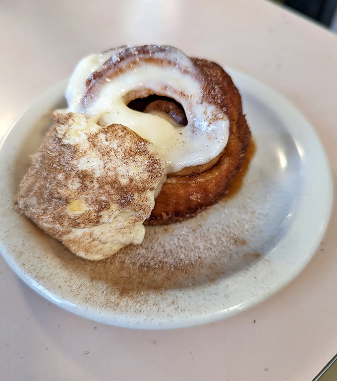 Fresh cinnamon rolls that arrive looking like edible hugs, dusted with sweetness and pure morning happiness.