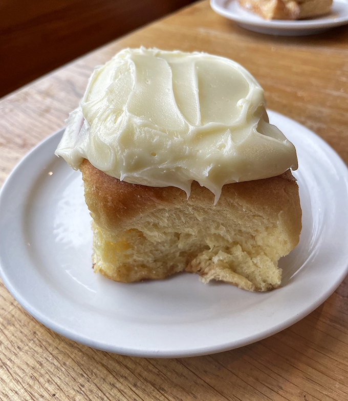 This cinnamon roll isn't playing games. Beneath that cream cheese frosting lies a spiral of cinnamon perfection that would make your grandmother weep with joy.