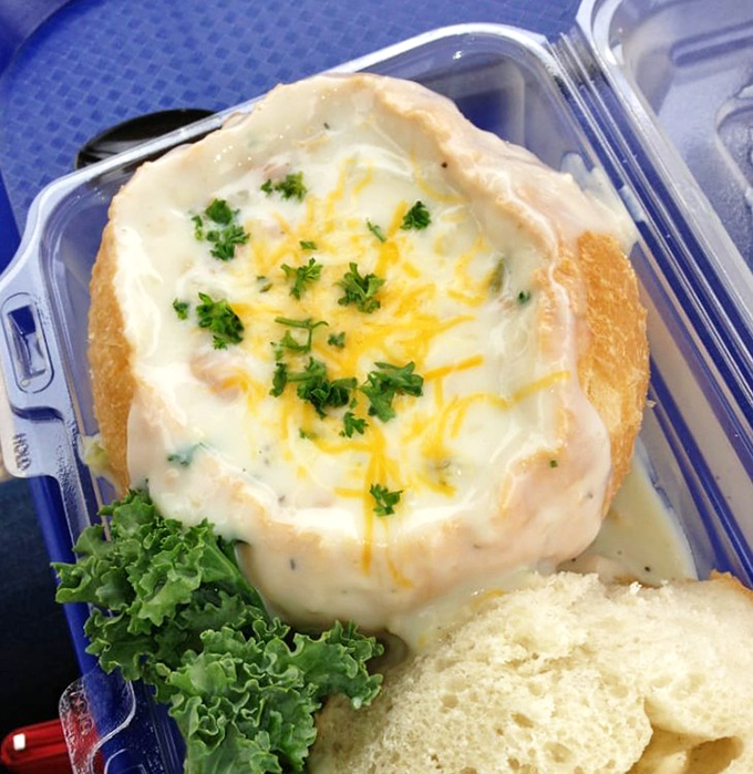 Bread bowls: where soup meets architectural achievement. This clam chowder isn't just eaten&mdash;it's experienced, one creamy, cheese-topped spoonful at a time.