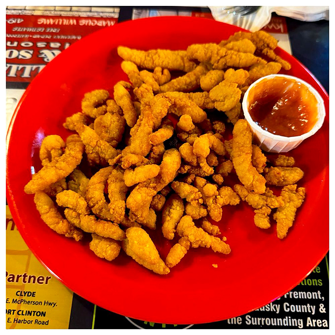 These clam strips aren't just appetizers—they're gateway seafood that converts even the most stubborn landlubber into a believer.