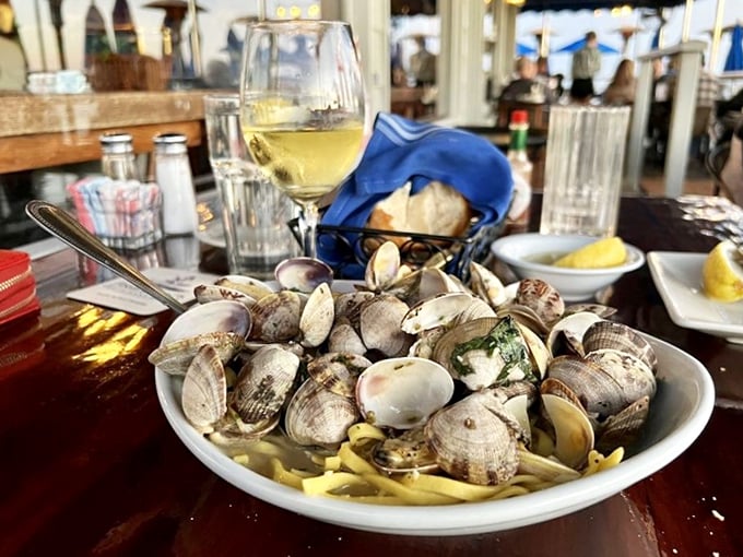 Life achievement unlocked: twirling pasta loaded with fresh clams while sipping chardonnay as waves crash just feet away. This is peak California living.