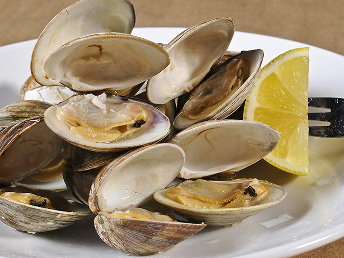 These littleneck clams, steamed to perfection and served with lemon, remind you that sometimes the ocean's simplest offerings deliver the most profound pleasure.