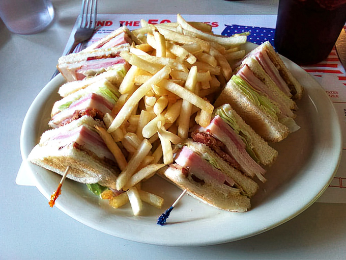 The club sandwich&mdash;architecture you can eat. Three stories of deliciousness held together with toothpick engineering.