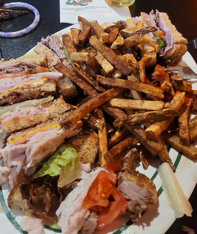 The club sandwich&mdash;architecture you can eat. Layers of deli goodness flanked by perfectly toasted bread, with fries so golden they deserve their own trophy case.