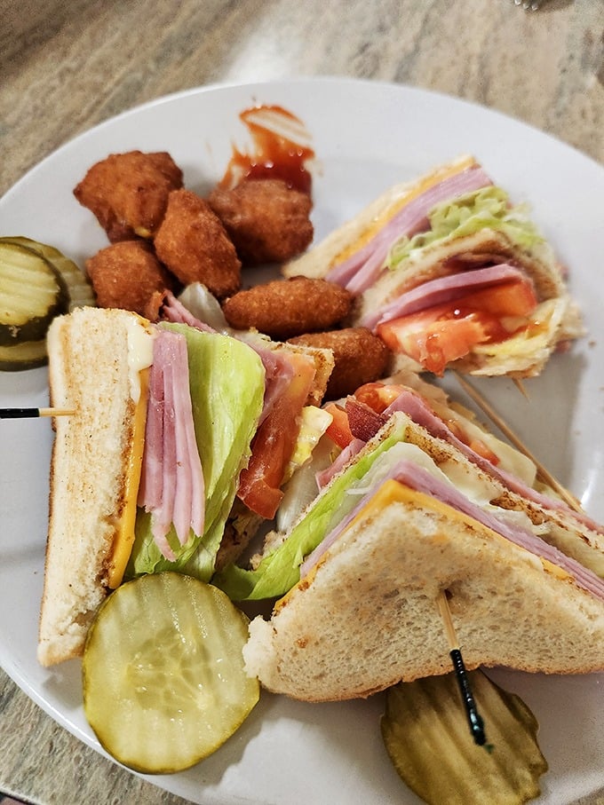 The club sandwich&mdash;architecture you can eat. Three perfectly toasted stories of bread supporting the delicious neighborhood of meat, cheese, and veggies.