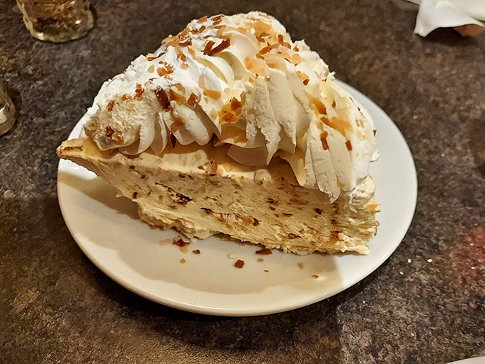 Coconut cream pie topped with toasted flakes and whipped cream&mdash;a dessert so good you'll contemplate ordering a second slice before finishing the first.