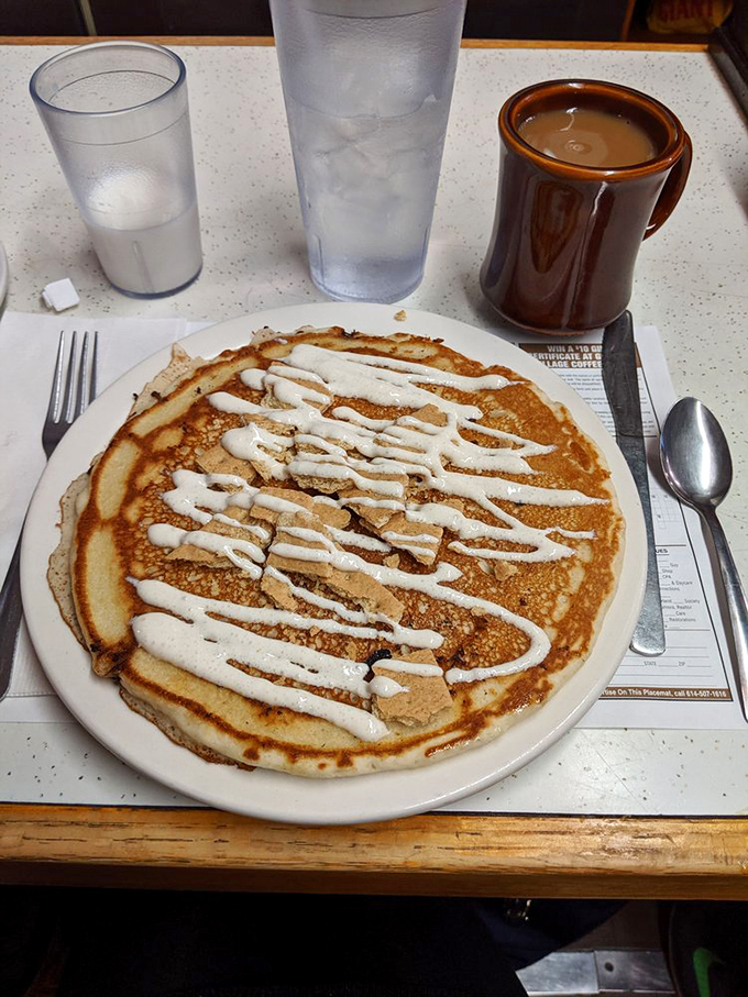 Golden pancakes and steaming coffee create the perfect symphony of morning indulgence and caffeinated bliss.