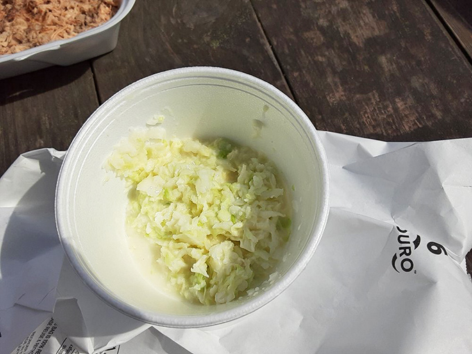 This isn't your supermarket coleslaw. Crisp, vinegary, and ready to cut through rich pork like a culinary counterpoint.