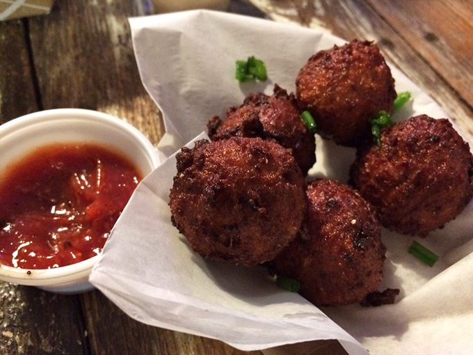 These conch fritters look like edible postcards from the ocean floor, crispy on the outside and full of maritime magic within.
