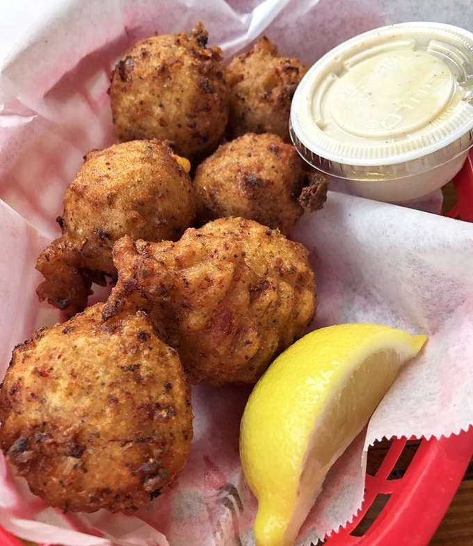 Conch fritters: golden orbs of happiness that make you wonder why more foods aren't spherical. The perfect vehicle for delivering Caribbean flavor straight to your soul.