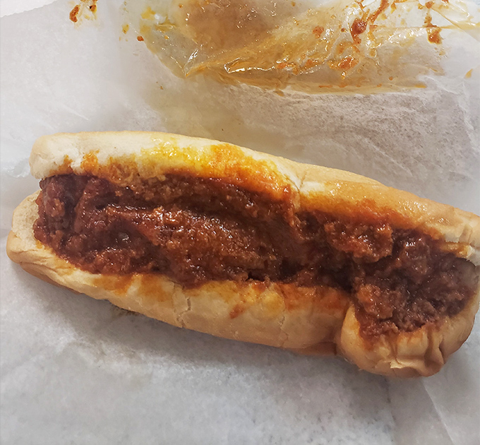 The classic coney dog &ndash; where spiced meat sauce meets soft bun in a relationship so perfect it should have its own reality show.