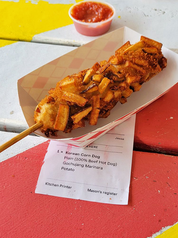 The Korean Corn Dog: where street food meets culinary adventure. Those crispy potato bits on the outside? That's what food scientists call "textural perfection."