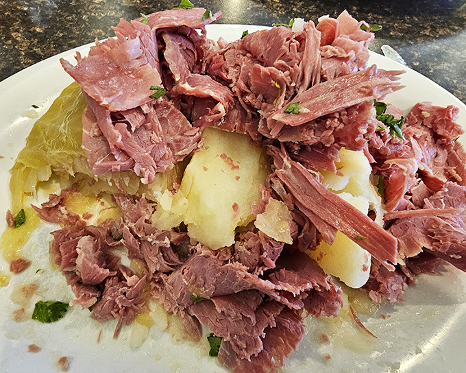 Corned beef and potatoes arranged like a savory crown jewel. This plate doesn't just feed you – it hugs you from the inside.