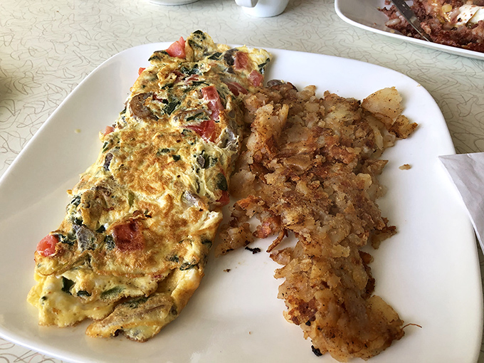A vegetable omelet that actually delivers on its promise&mdash;packed with fresh ingredients and paired with home fries that deserve their own fan club.