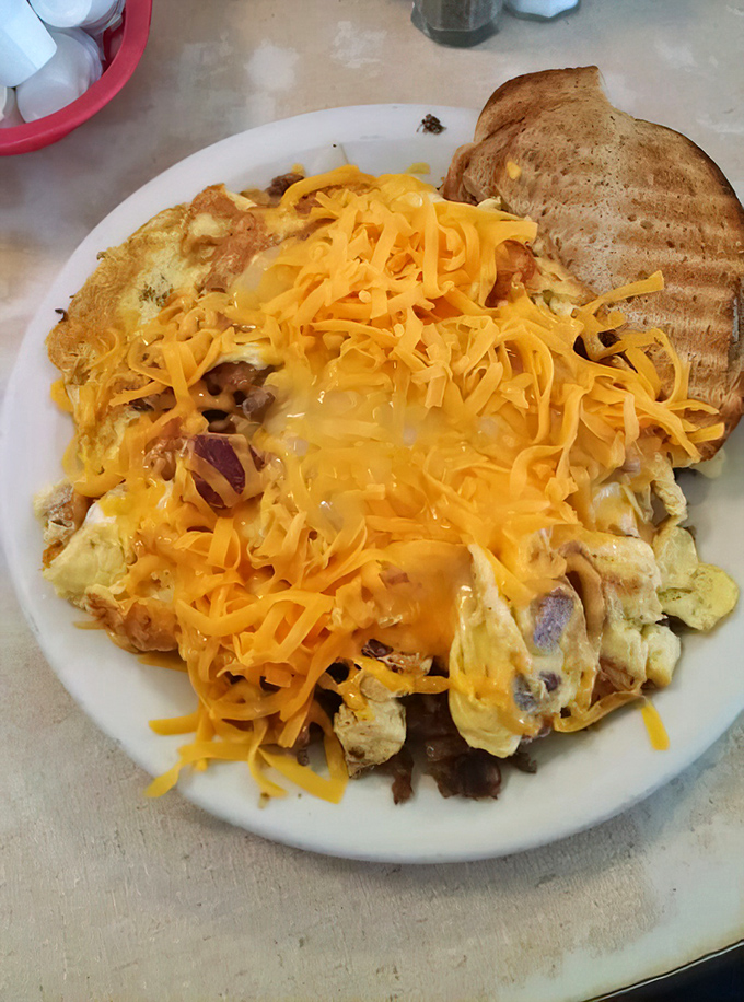 When cheese meets eggs meets corned beef, magic happens. This scrambler is what breakfast dreams are made of&mdash;hearty, unpretentious, and gloriously excessive.