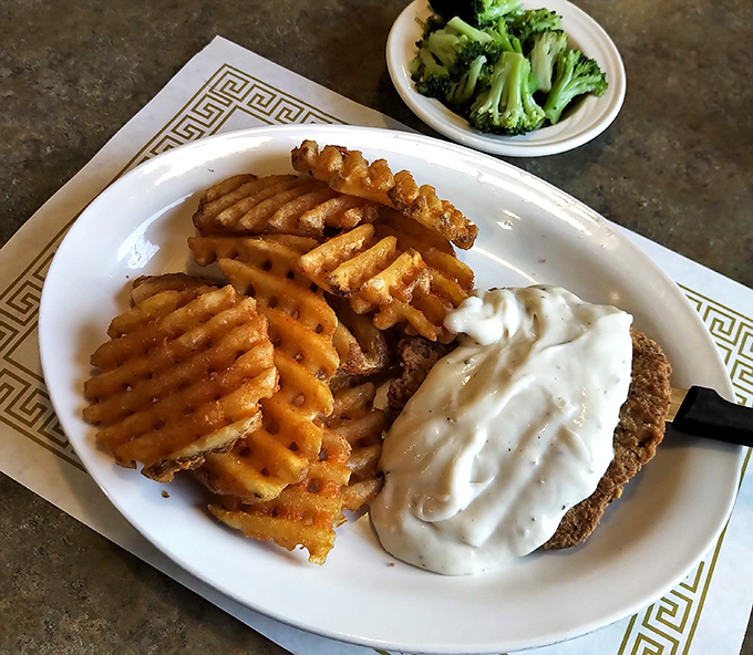 The legendary country fried steak with its golden armor of crispy coating and river of creamy gravy. This isn't just dinner&mdash;it's an Ohio institution.