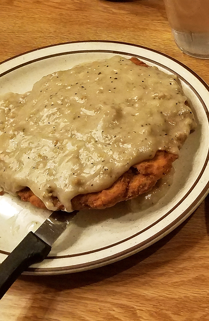 Country fried steak swimming in gravy so good you'll be tempted to ask for a straw instead of a fork.