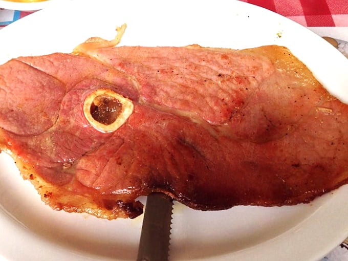 Virginia country ham, sliced thin enough to read through, brings that perfect salt-cured flavor that's been perfected over generations.