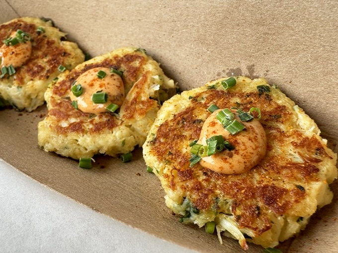 These crab cakes aren't playing the filler game. Mostly crab, barely bound, and topped with a single shrimp&mdash;like a cherry on top of seafood paradise.