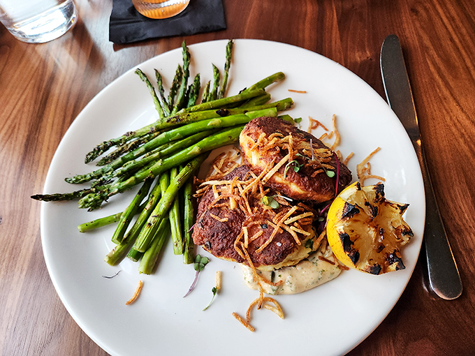 Seared to perfection and nestled beside vibrant asparagus, these crab cakes are what seafood dreams are made of.