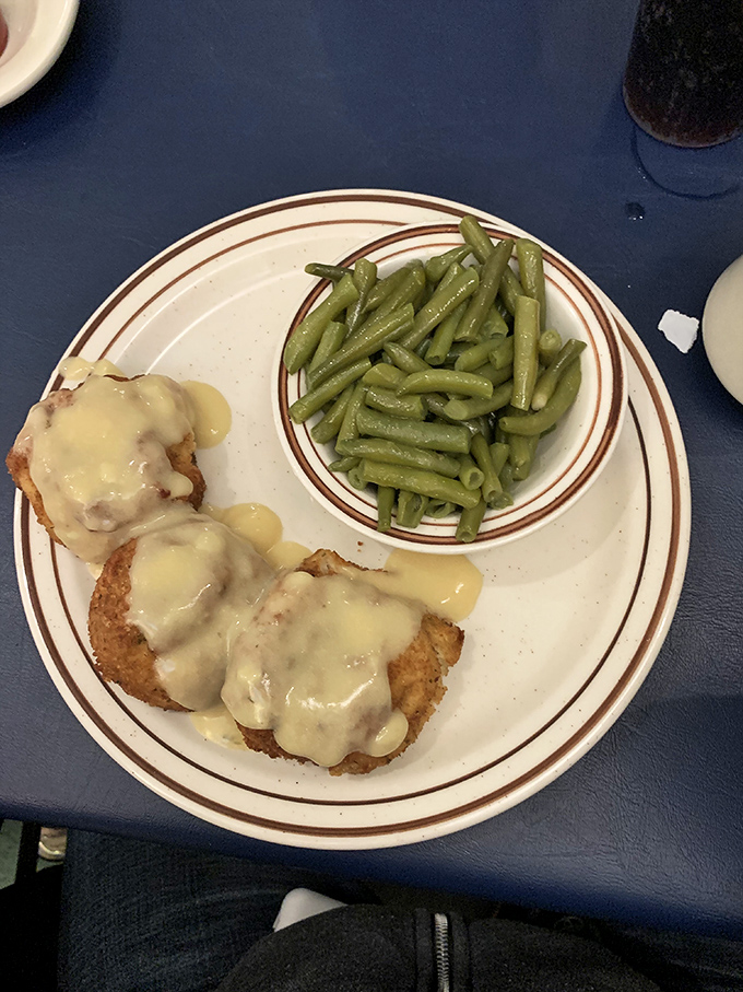 Crab cakes with green beans&mdash;a marriage of land and sea that proves simplicity often trumps complexity. No fancy garnishes needed when the cooking speaks for itself.