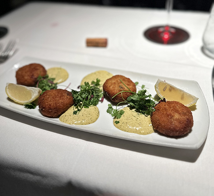 Golden-brown crab cakes that are actually crab (imagine that!)&mdash;perched atop creamy sauce with fresh herbs that make seafood lovers weak at the knees.